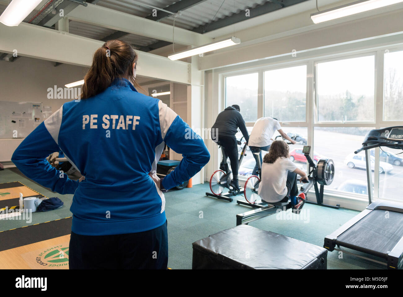 students work out and train in a gym during a lesson at college Stock ...