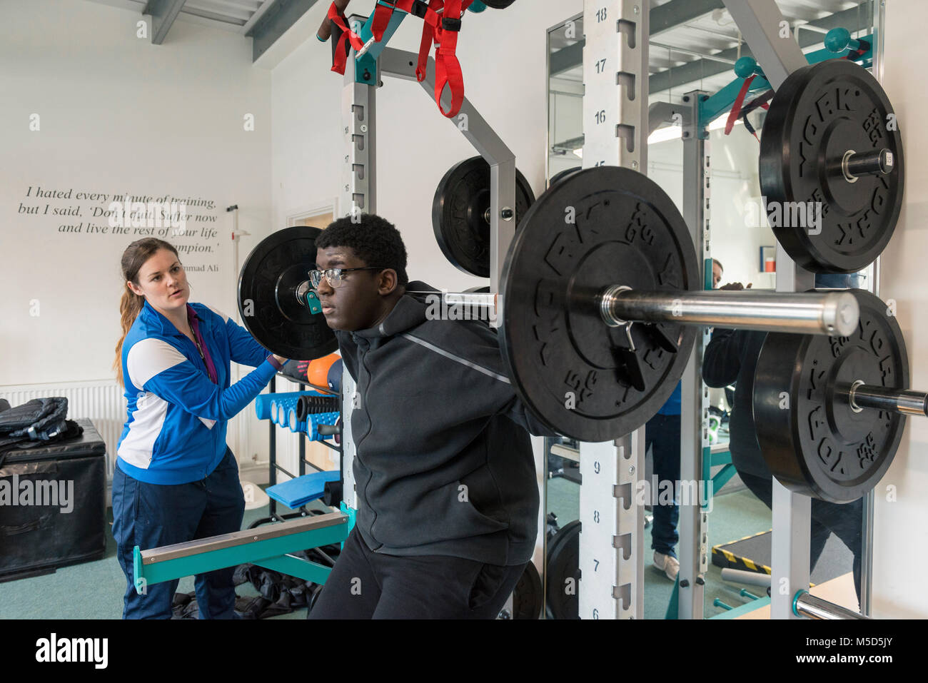 students work out and train in a gym during a lesson at college Stock ...