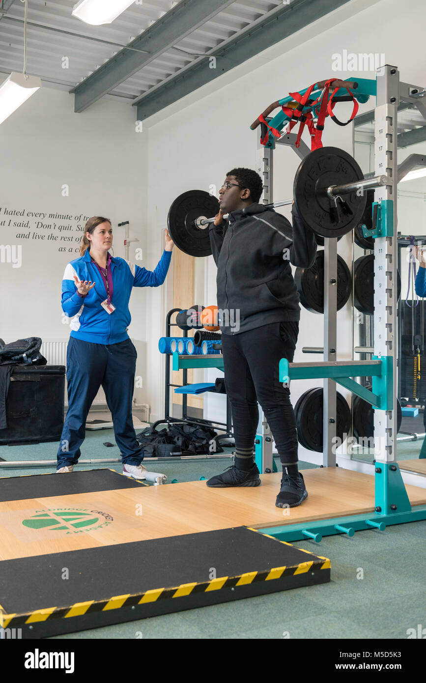 students work out and train in a gym during a lesson at college Stock ...