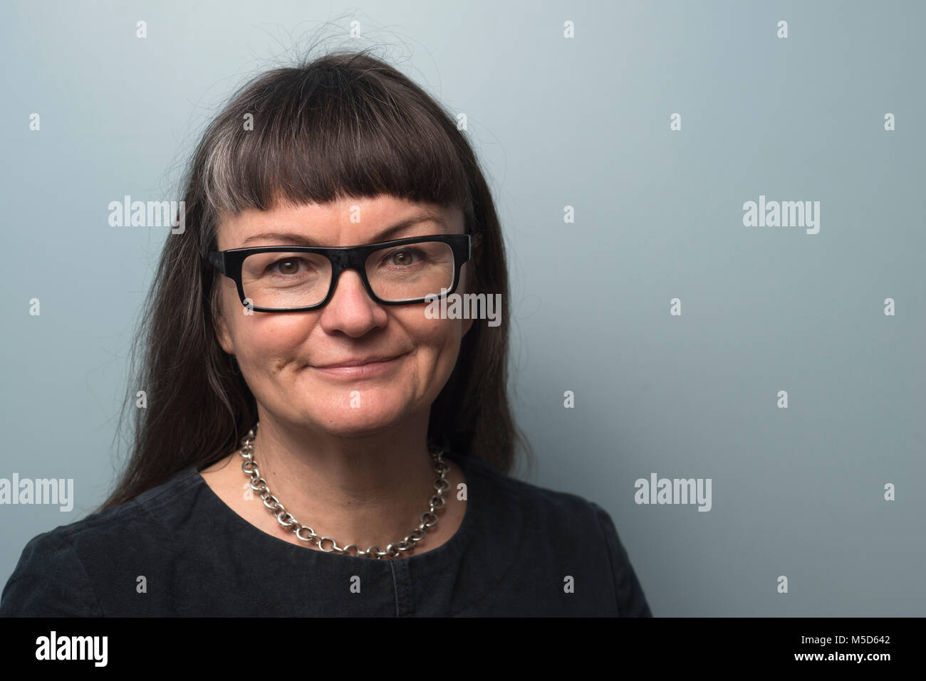 a confident happy writer and author has their portrait taken Stock ...