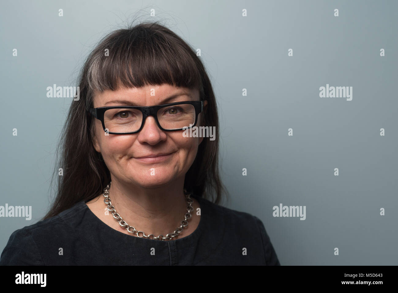 a confident happy writer and author has their portrait taken Stock ...