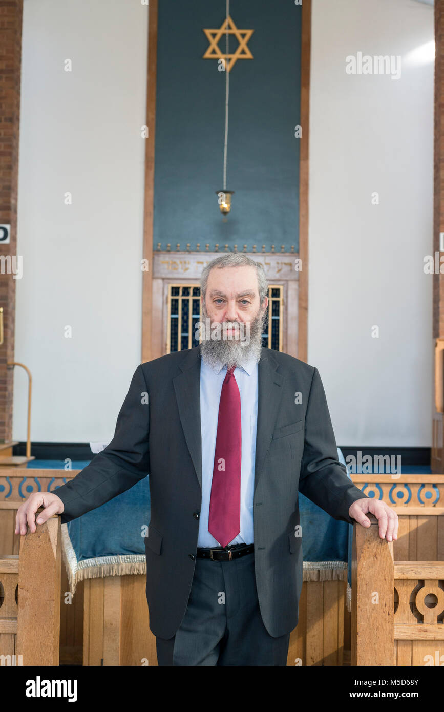a rabbi stands in a synagogue for a portrait Stock Photo - Alamy