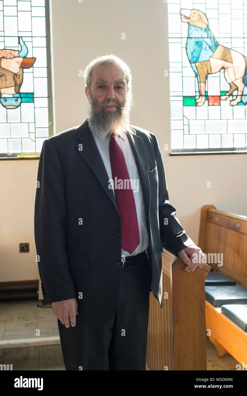 a rabbi stands in a synagogue for a portrait Stock Photo - Alamy