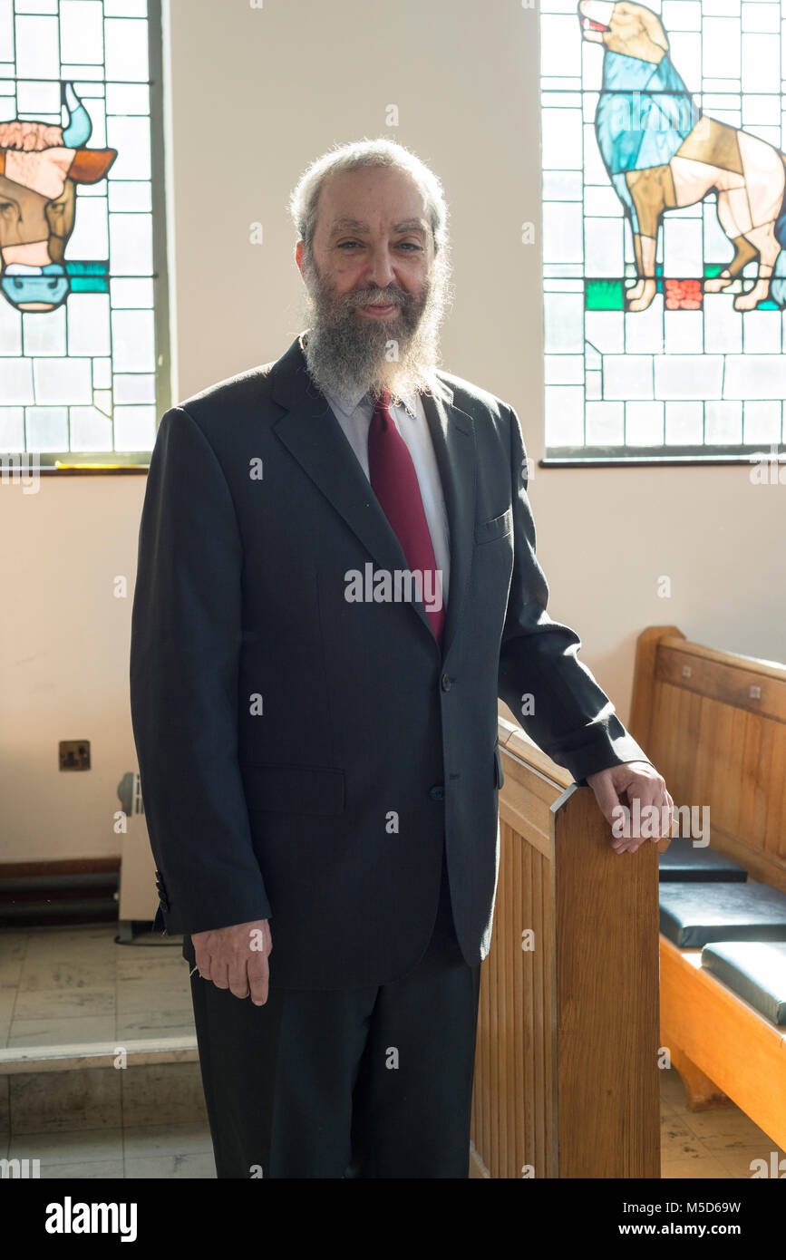 a rabbi stands in a synagogue for a portrait Stock Photo - Alamy