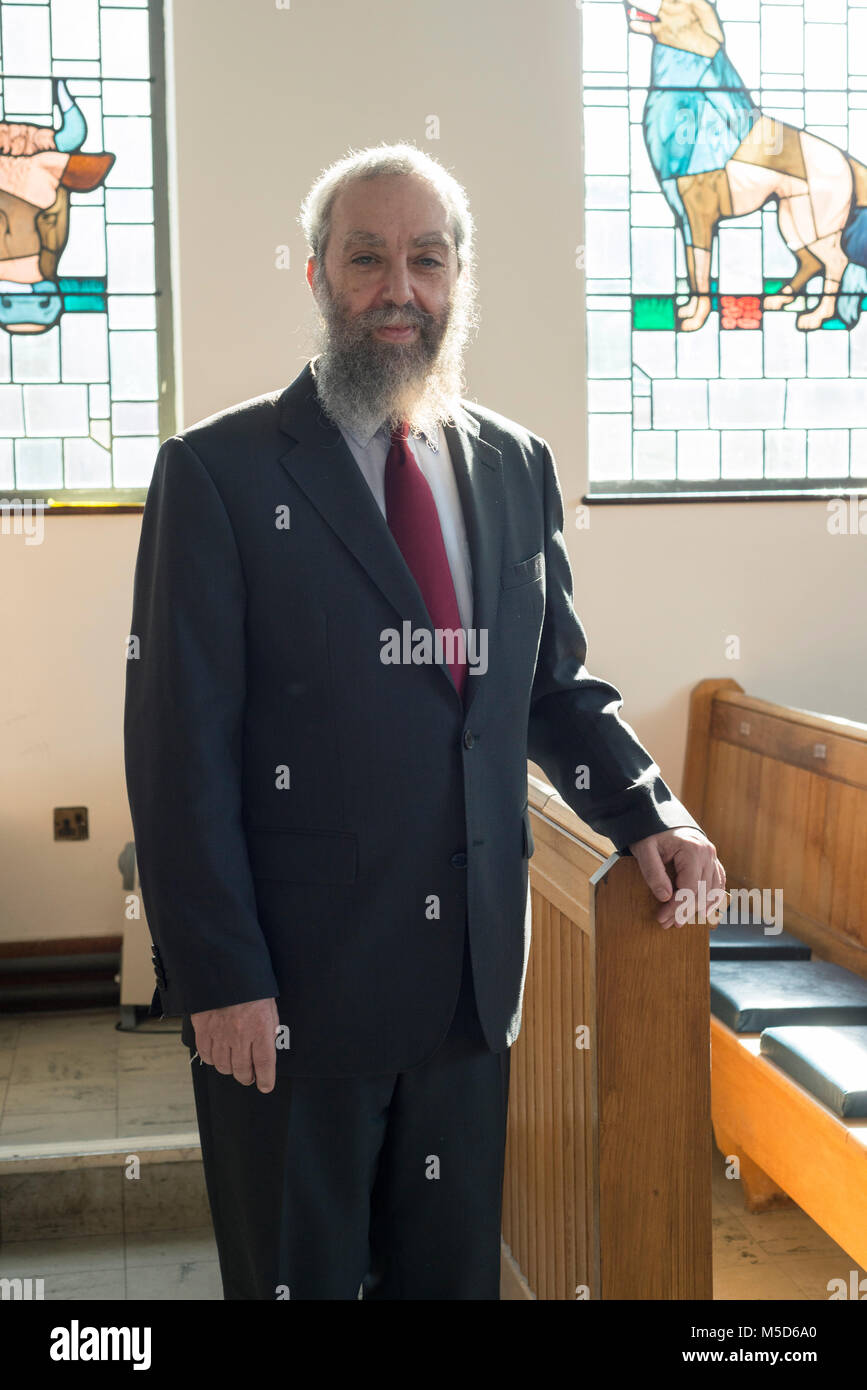 a rabbi stands in a synagogue for a portrait Stock Photo - Alamy