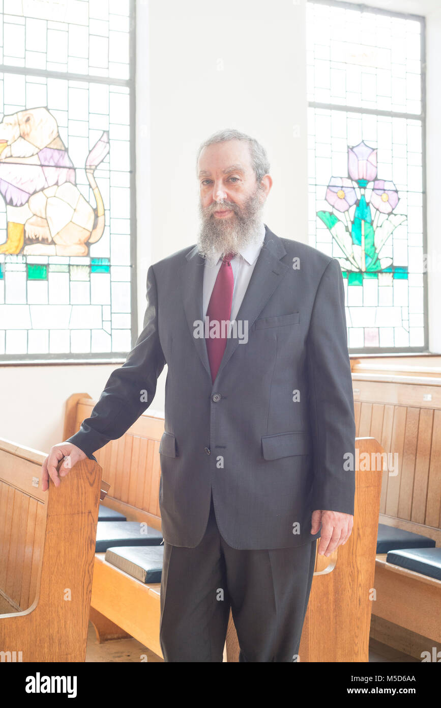 a rabbi stands in a synagogue for a portrait Stock Photo - Alamy