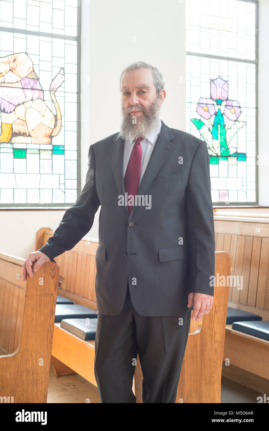 a rabbi stands in a synagogue for a portrait Stock Photo - Alamy