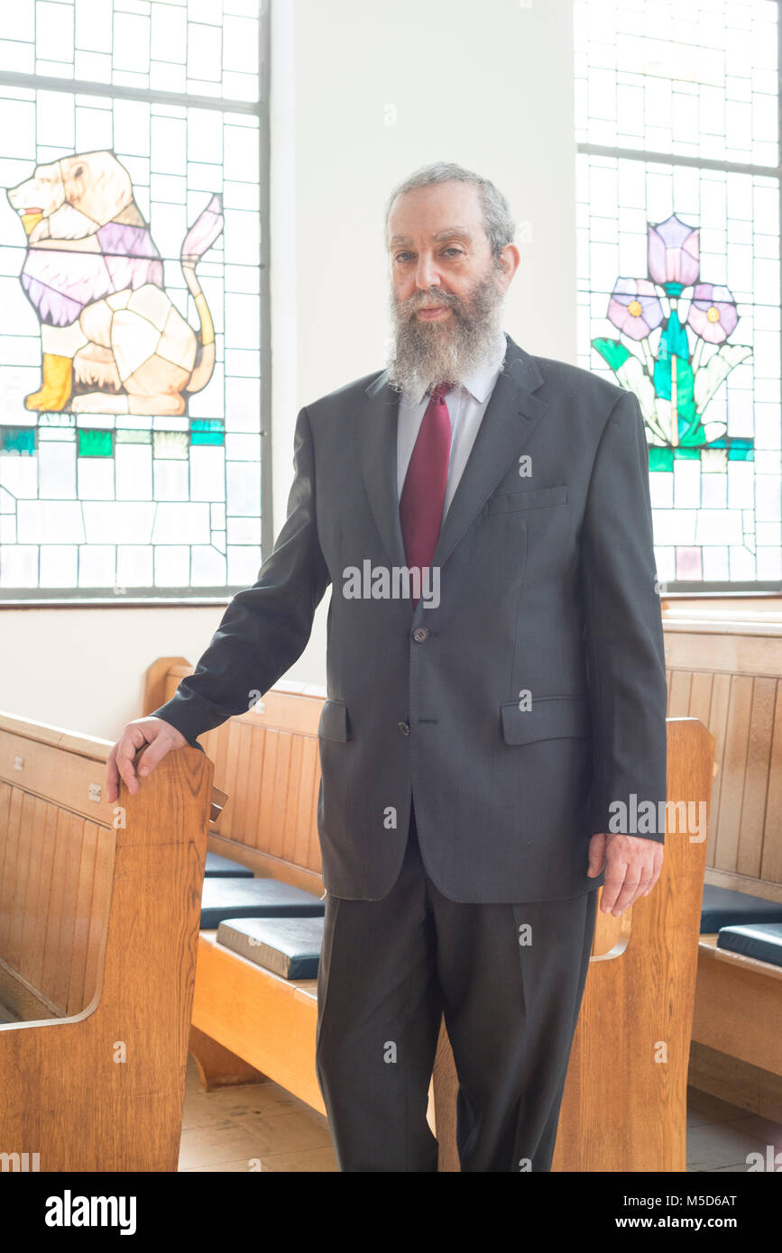 a rabbi stands in a synagogue for a portrait Stock Photo - Alamy