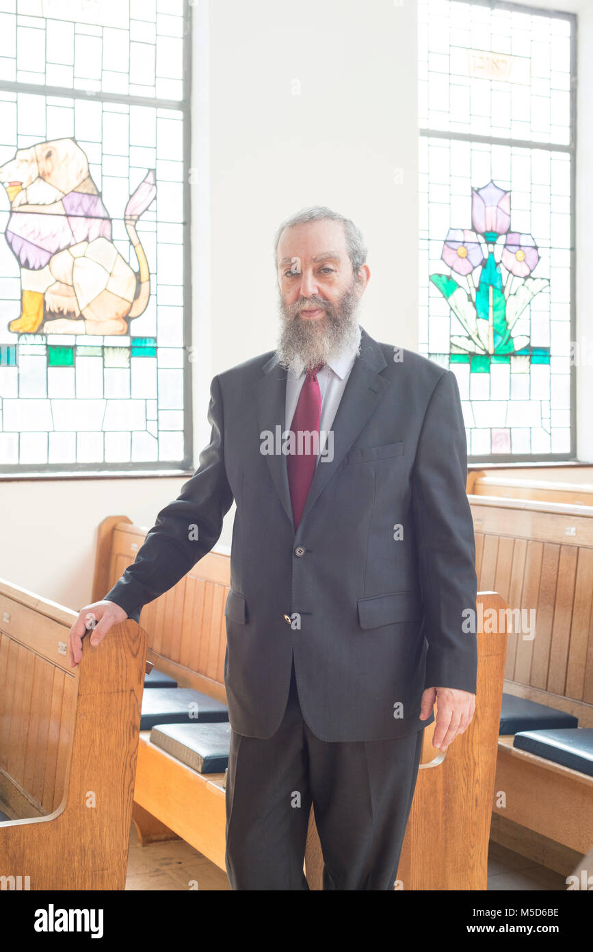 a rabbi stands in a synagogue for a portrait Stock Photo - Alamy