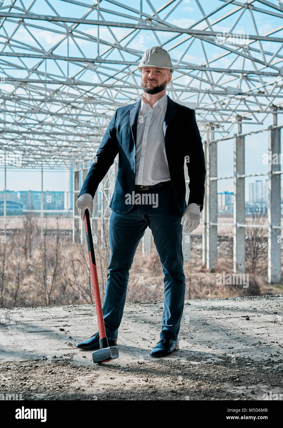 man in a business suit at a construction site Stock Photo - Alamy
