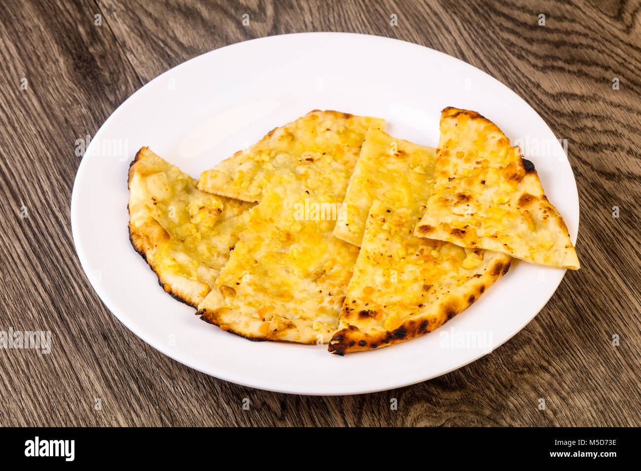 Indian bread - Naan with cheese and garlic Stock Photo - Alamy