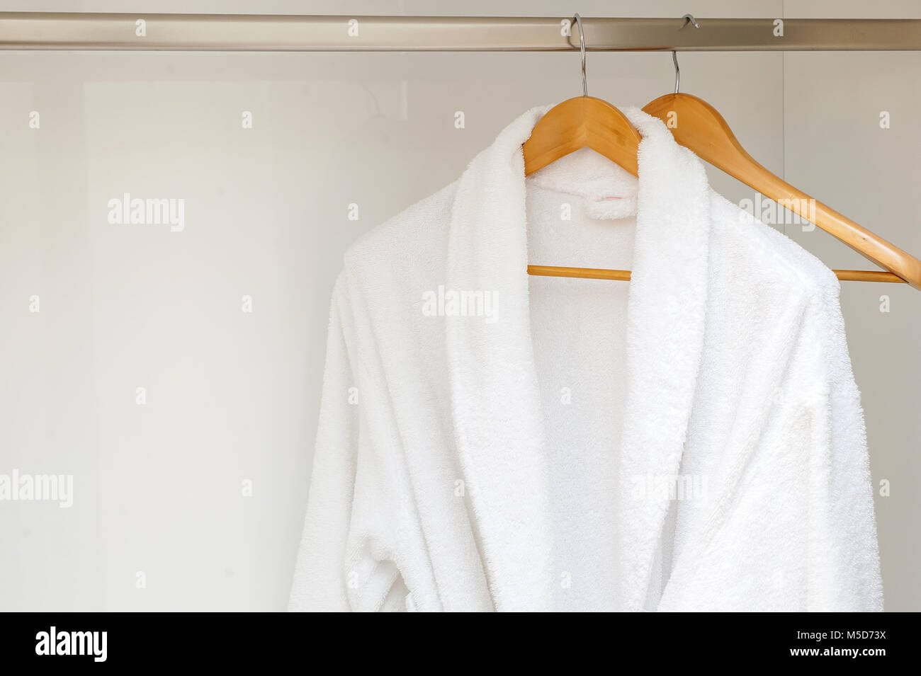 Close up of bathrobe in wardrobe background Stock Photo - Alamy