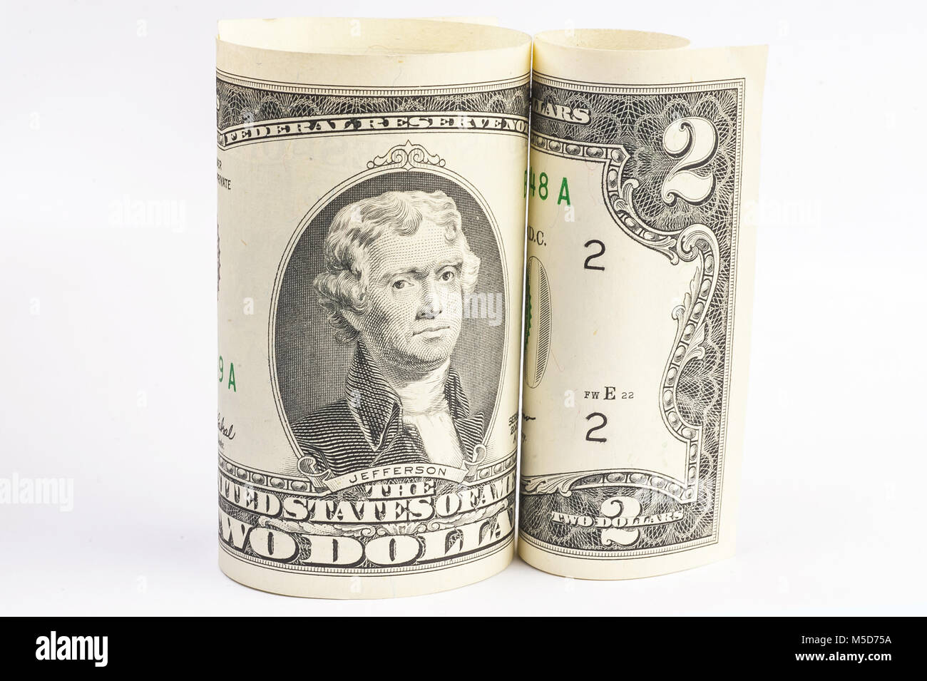 Two dollars isolated on white background Stock Photo - Alamy
