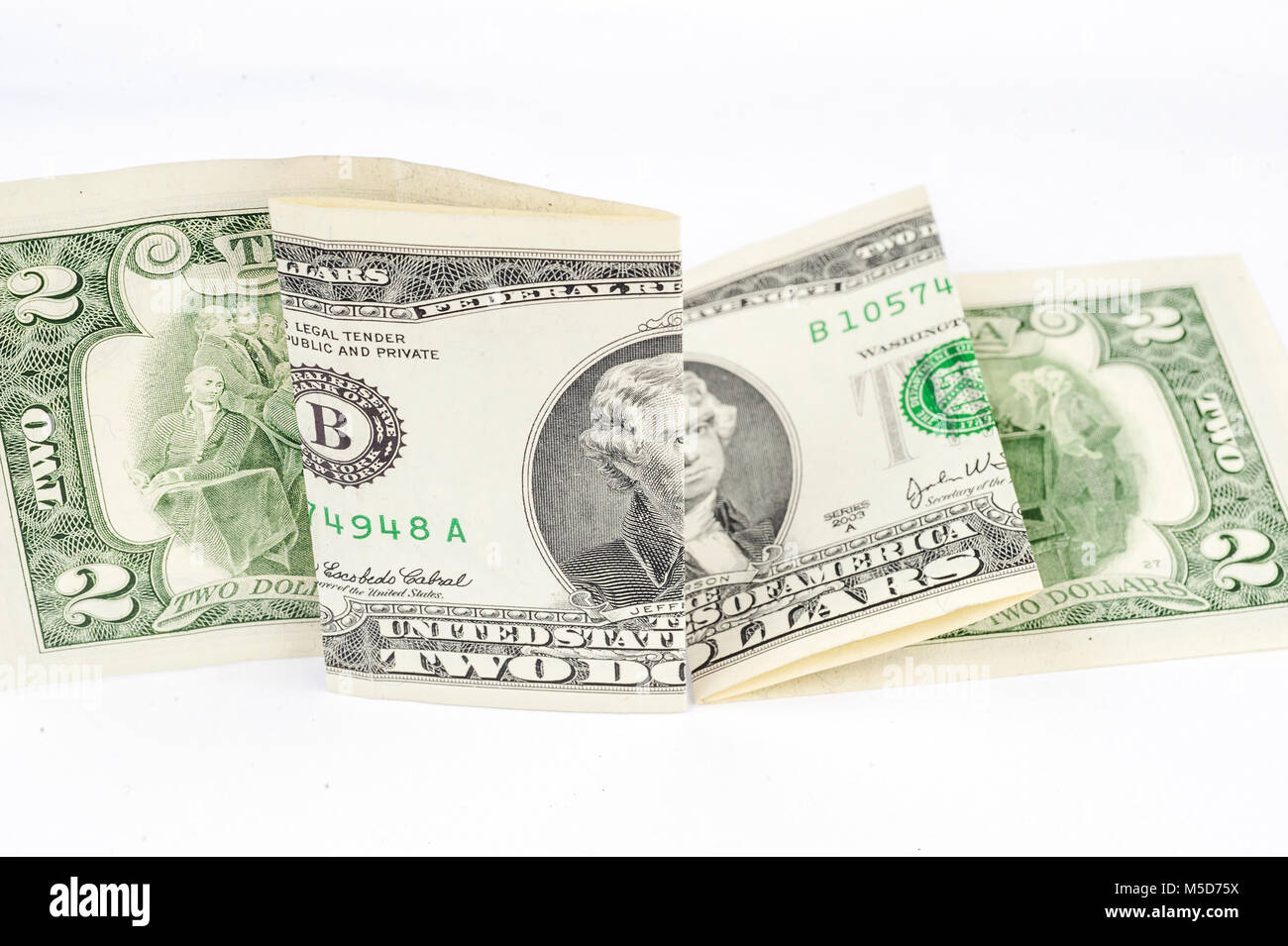 Two dollars isolated on white background Stock Photo - Alamy