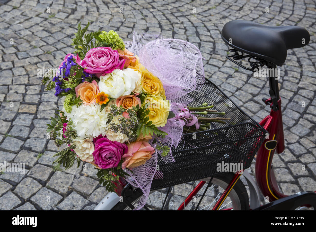 bouquet of flowers on a bicycle Stock Photo - Alamy
