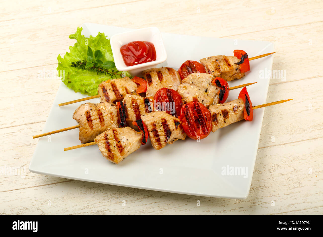 Grilled turkey skewer with tomato and pepper Stock Photo - Alamy