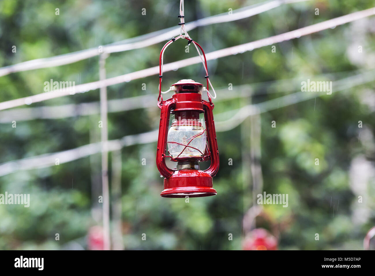 vintage kerosene oil lantern lamp hanging on the wire Stock Photo - Alamy