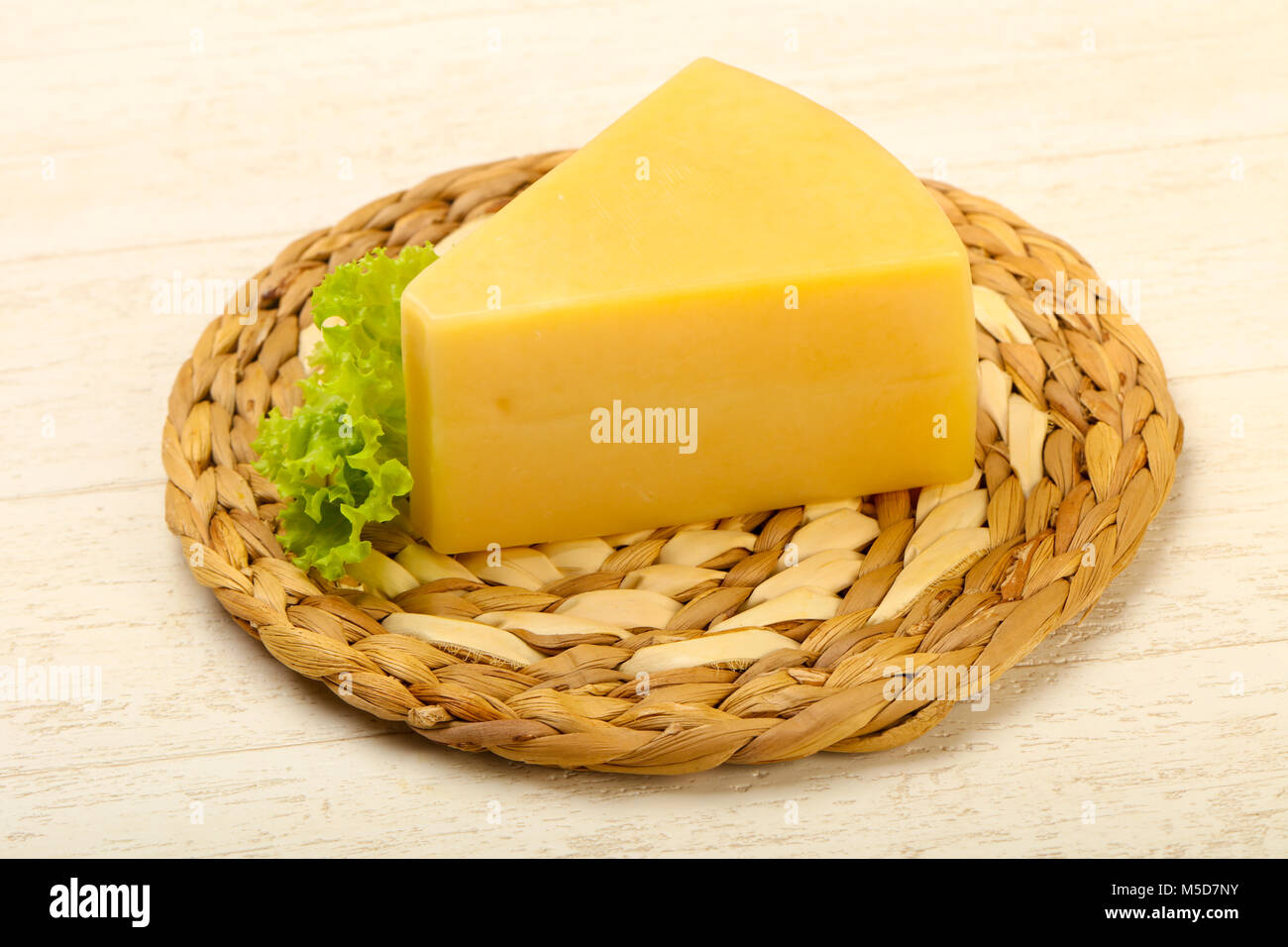 Parmesan cheese triangle Stock Photo - Alamy