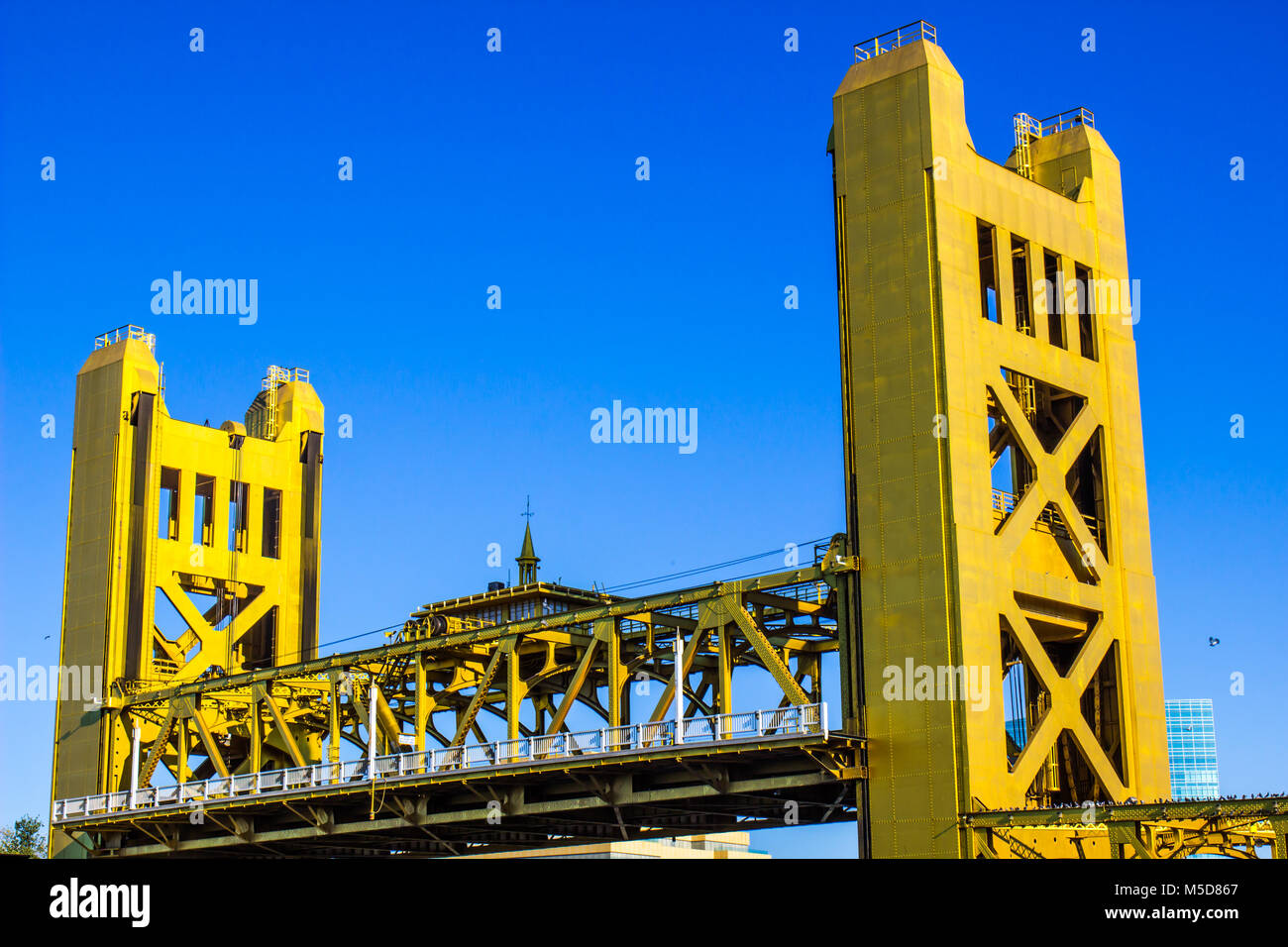 Yellow Towers On Modern Bridge Stock Photo - Alamy