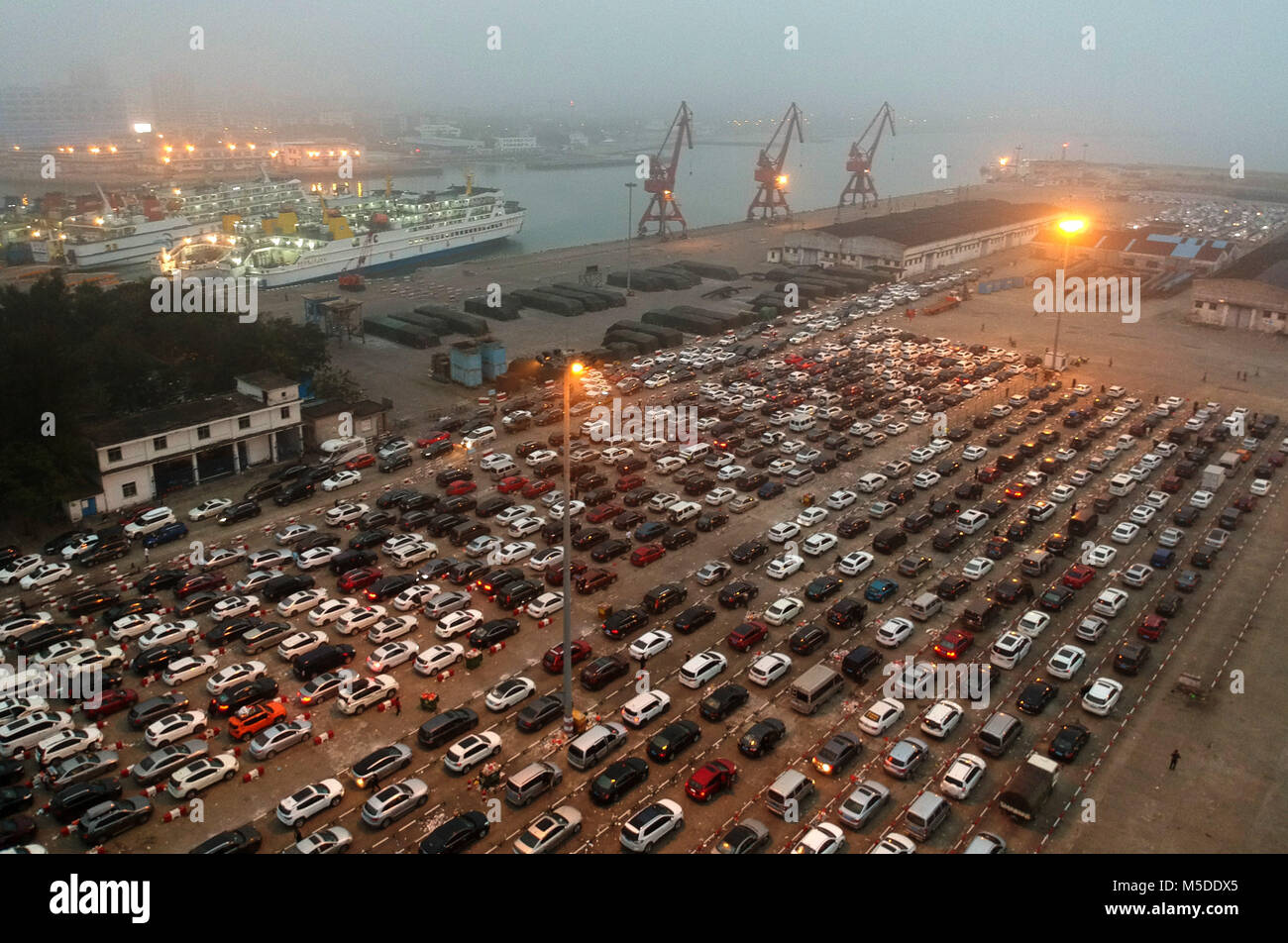Haikou, China's Hainan Province. 22nd Feb, 2018. Vehicles wait at ...