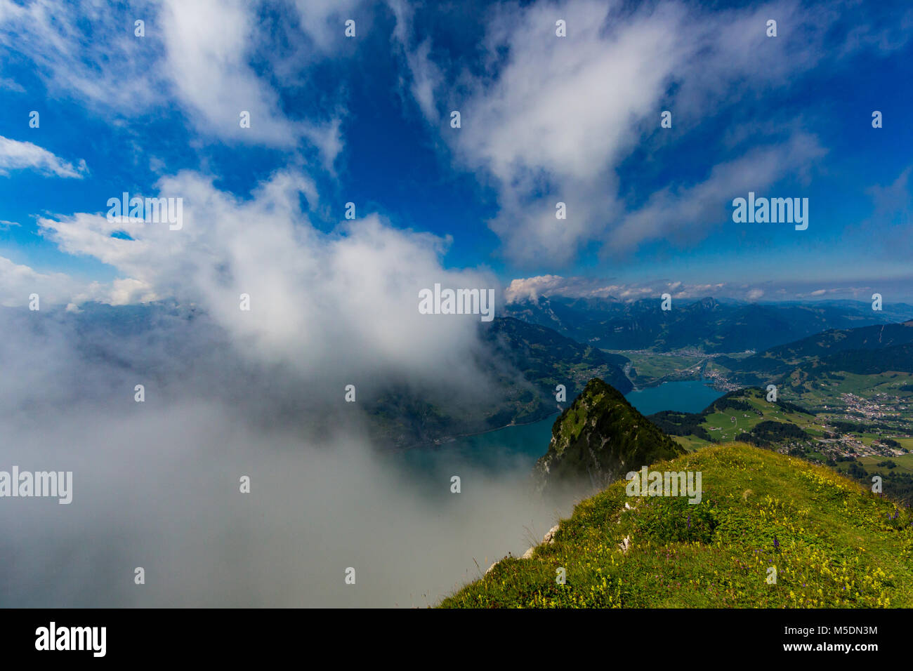 view from top of Leistkamm mountain on lake Walen, natural blue cloudy ...