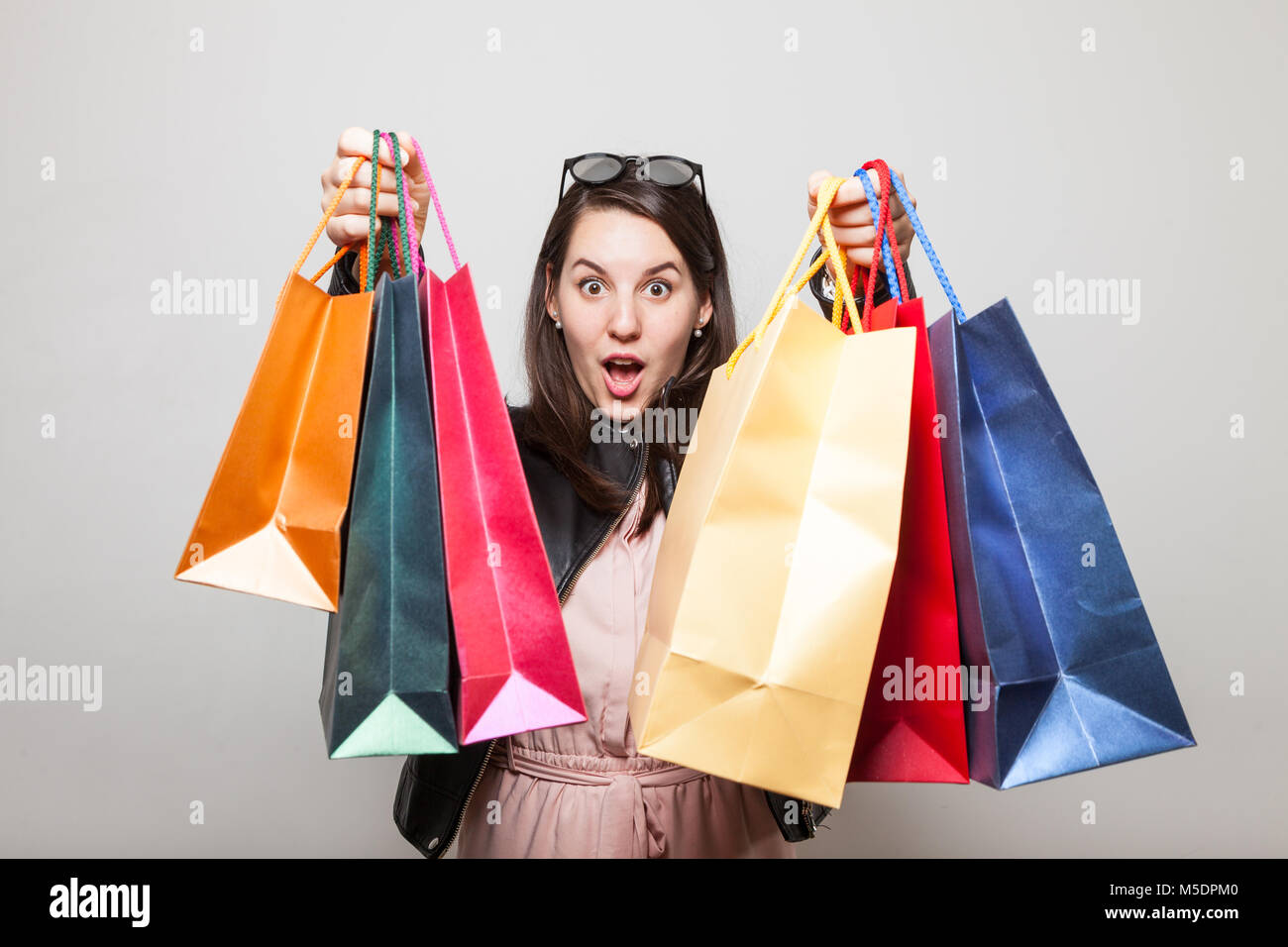 Surprised modern woman goes shopping on a christmas sale Stock Photo ...