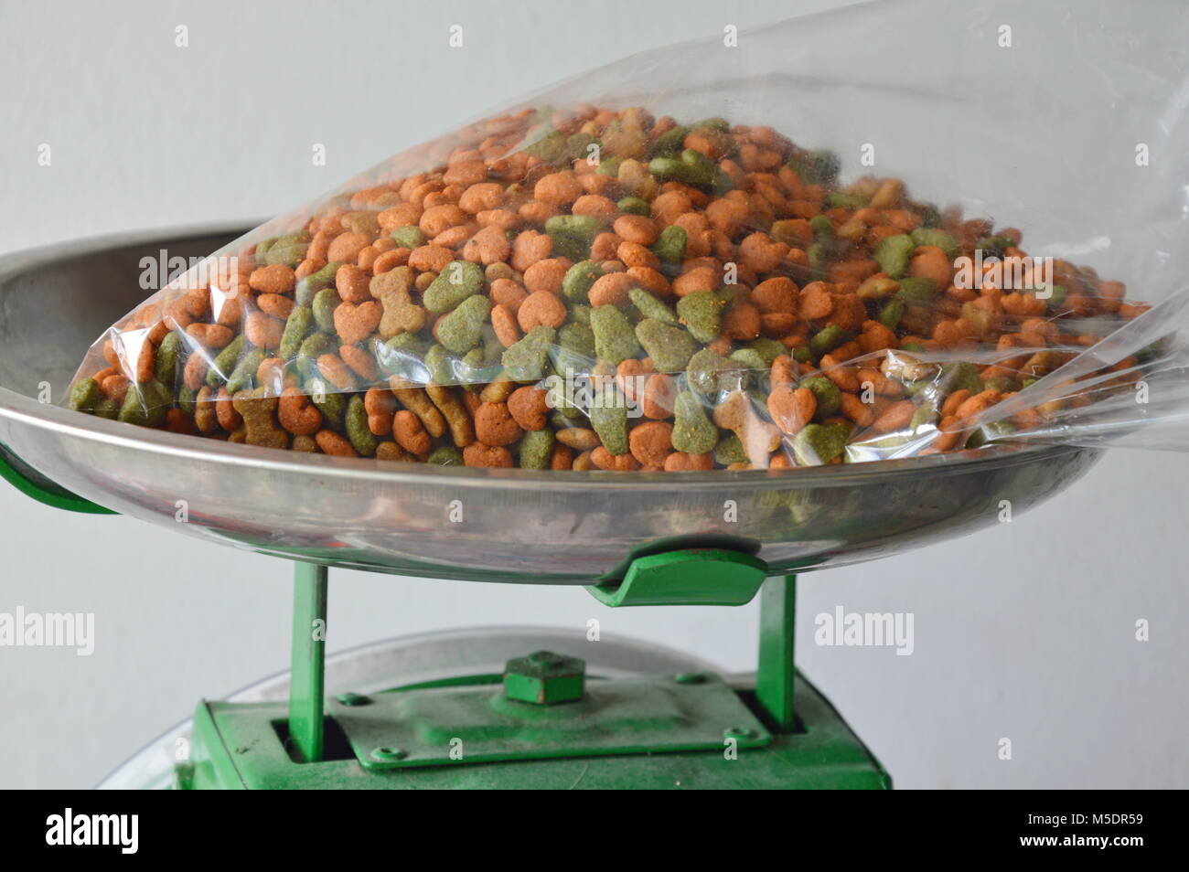 dog food in plastic bag on weighing scale tray Stock Photo - Alamy