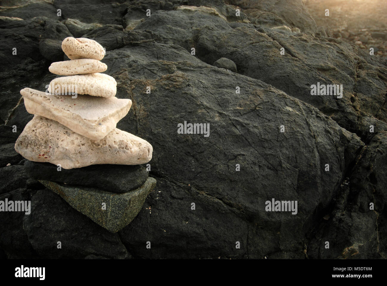 Stacked rocks and shells in Aruba Stock Photo - Alamy