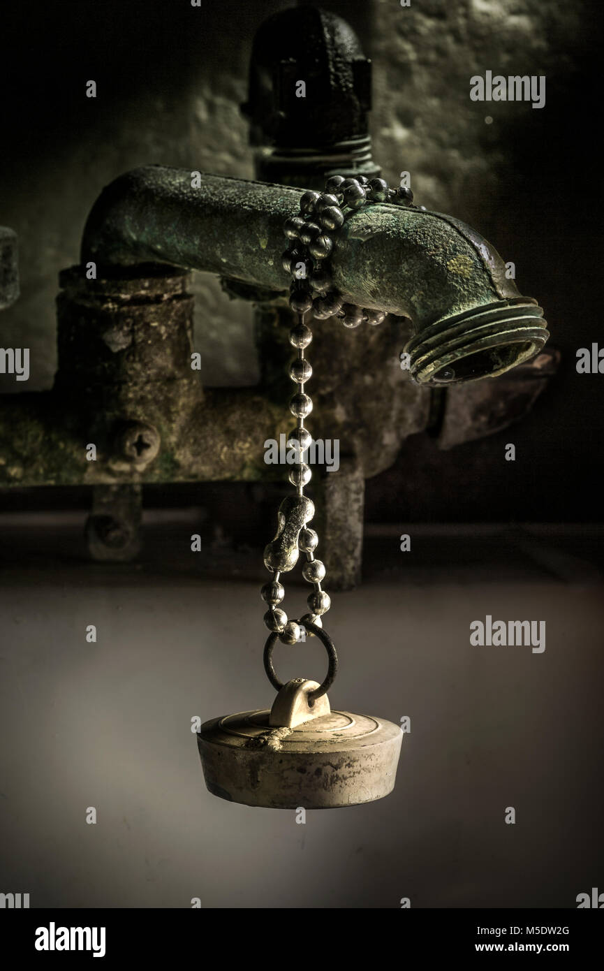 Artistic View Of Old Faucet & Rubber Drain Plug Stock Photo - Alamy