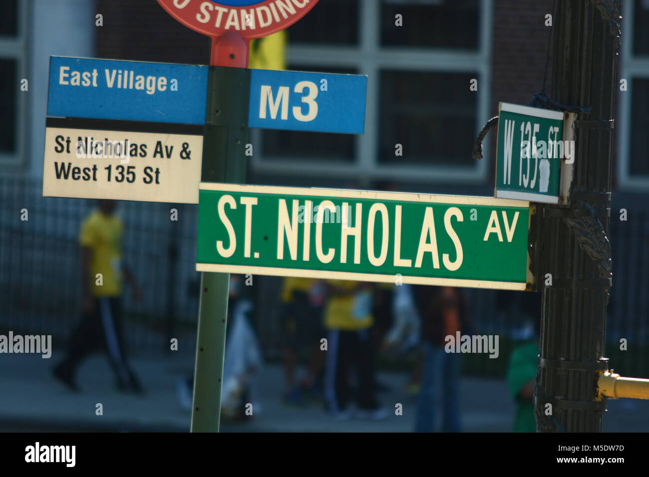 Harlem street signs hi-res stock photography and images - Alamy