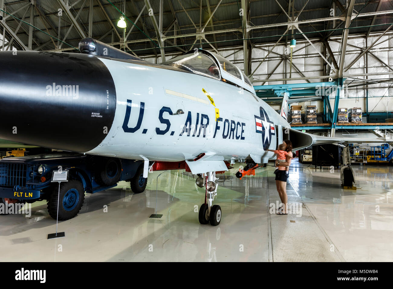 Woman and child admiring McDonnell F-101 Voodoo supersonic jet exhibit ...