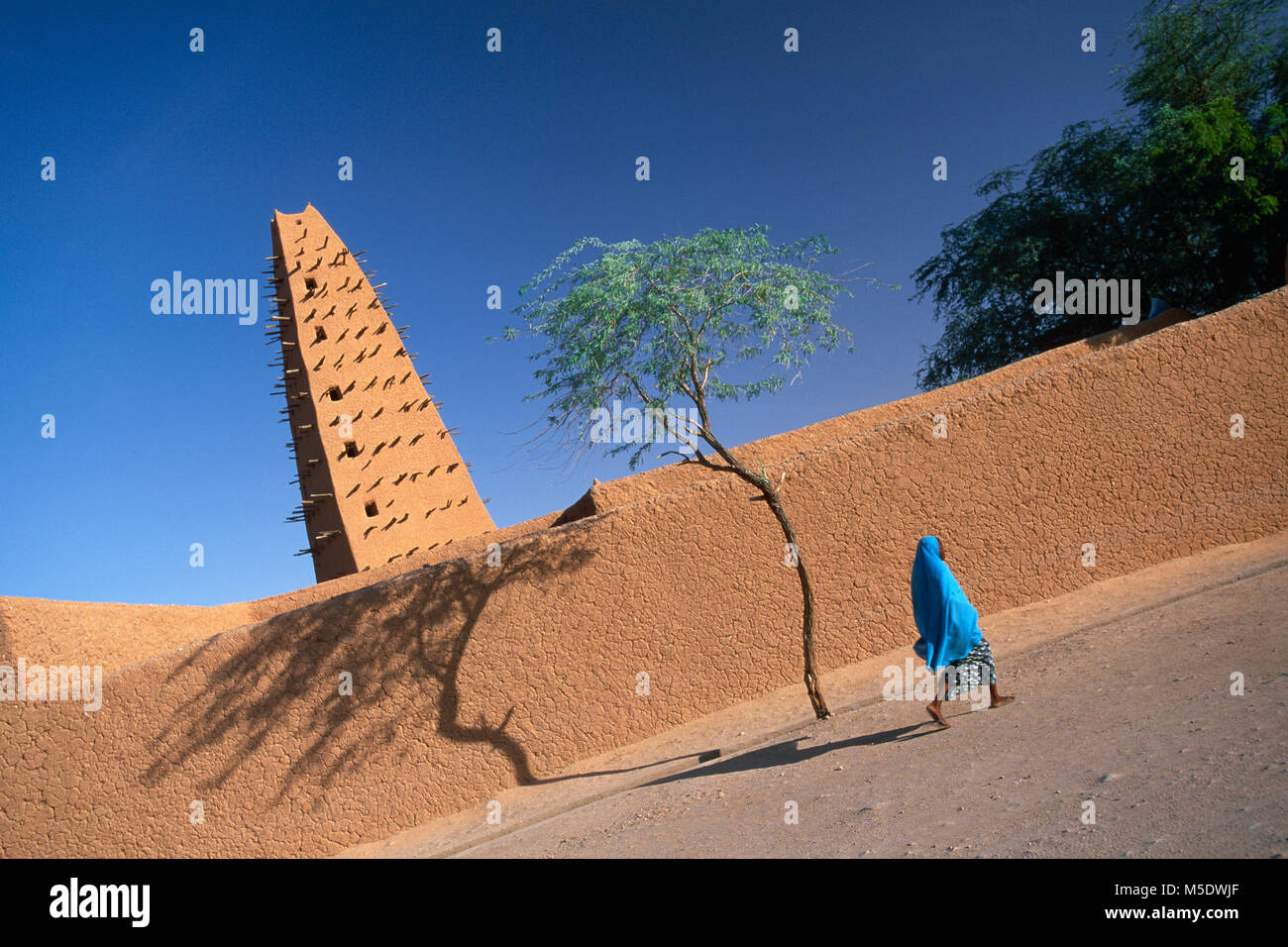 Niger. Agadez. Sahara desert. Sahel. Mosque. Woman walking. Unesco ...