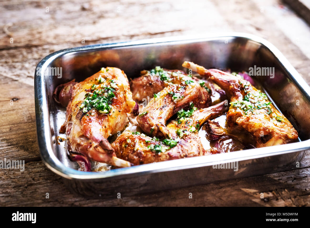Roasted rabbit leg Stock Photo - Alamy
