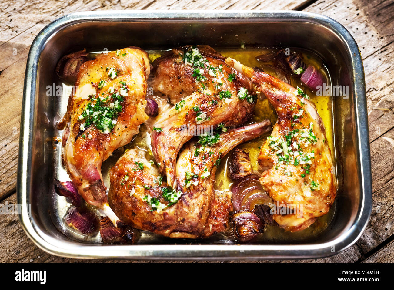 Roasted rabbit leg Stock Photo - Alamy