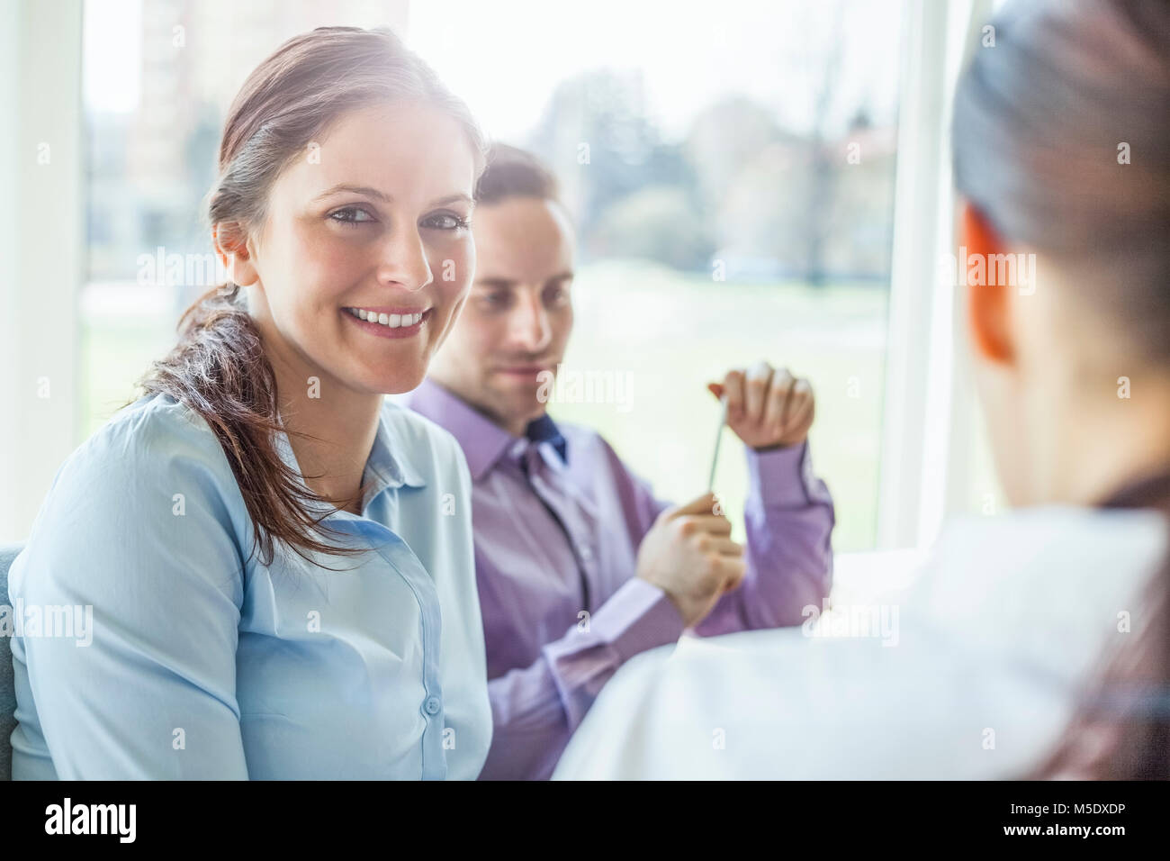 Three colleagues having office hi-res stock photography and images - Alamy