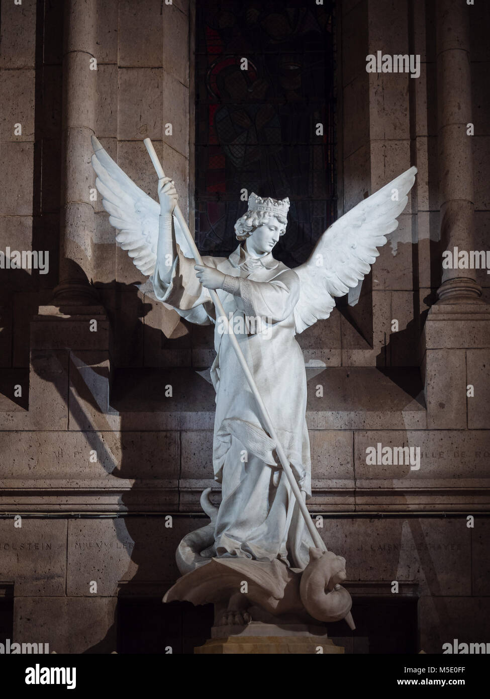 Paris, France - January 5, 2018: Statue of an angel in white stone ...