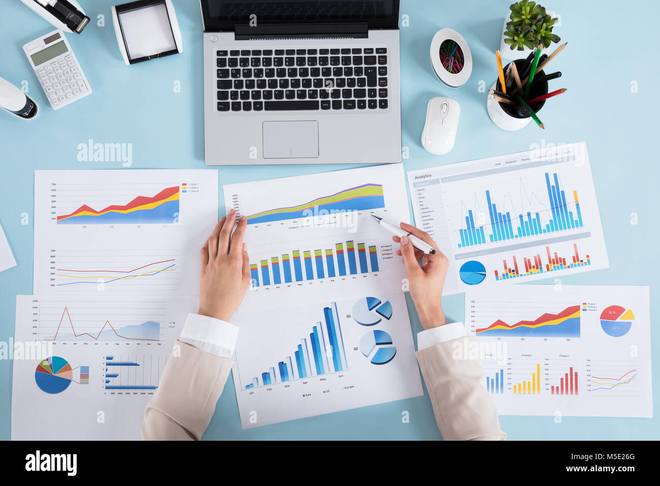 Woman manager working graphs on hi-res stock photography and images - Alamy