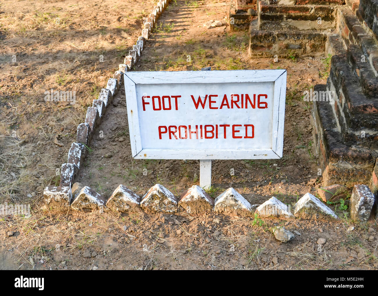 A sign in a temple in myanmar burma saying foot wearing prohibited ...