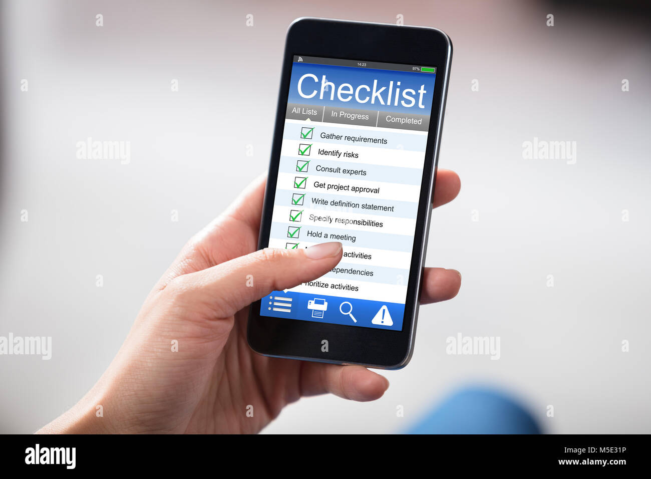 Using smartphone check list hi-res stock photography and images - Alamy