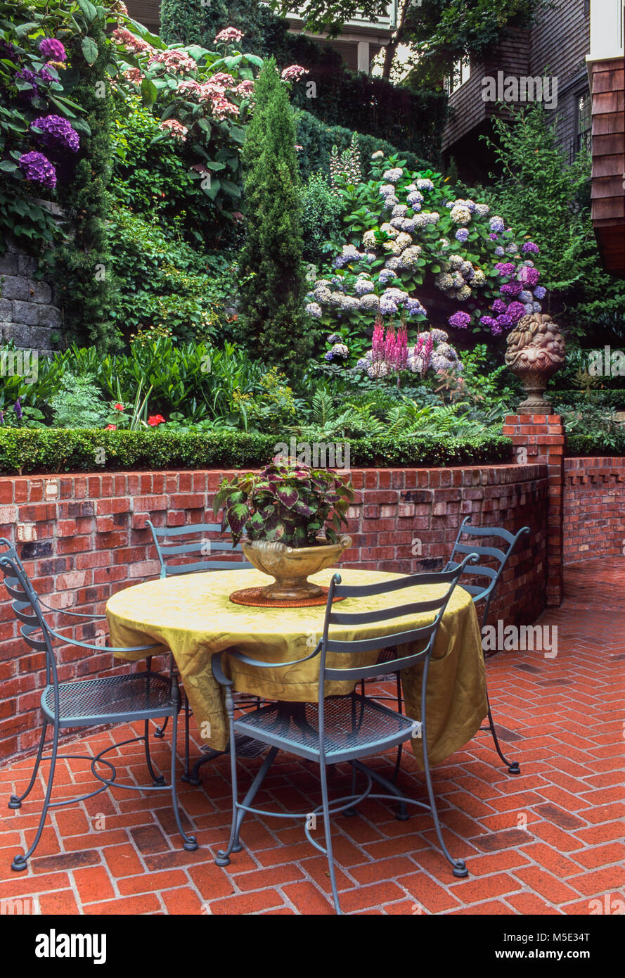 Garden and patio with table setting, brick Stock Photo - Alamy