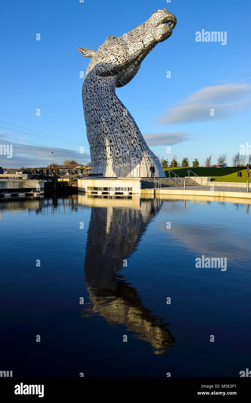 One of the Kelpie sculptures by Andy Scott reflected in the canal at ...