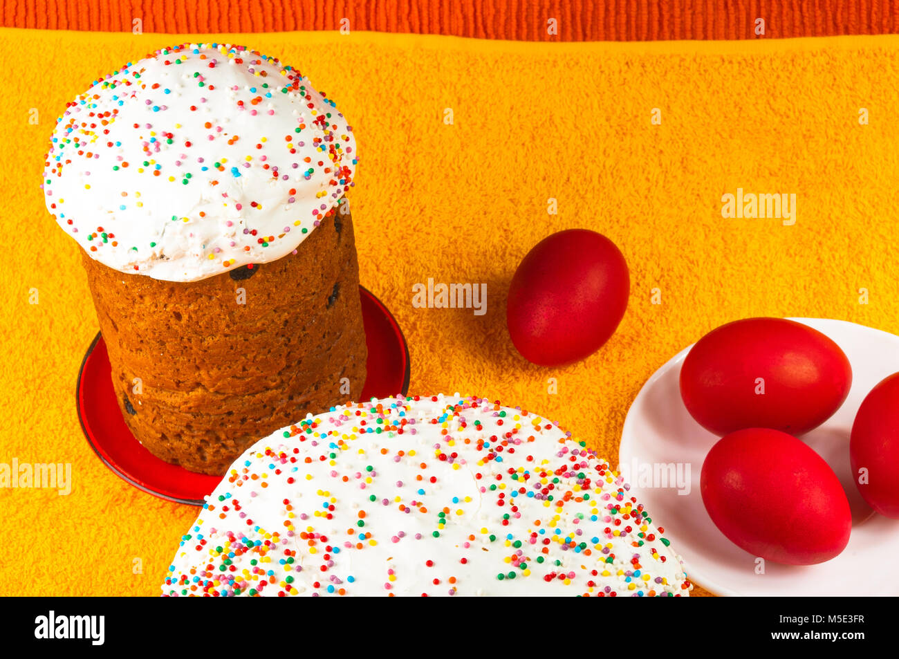 Kulichi, traditional Russian Easter cake with icing and dyed eggs Stock ...