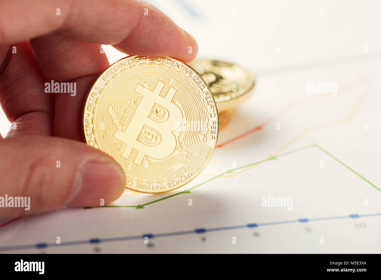 hand hold a bitcoin coin model Stock Photo - Alamy