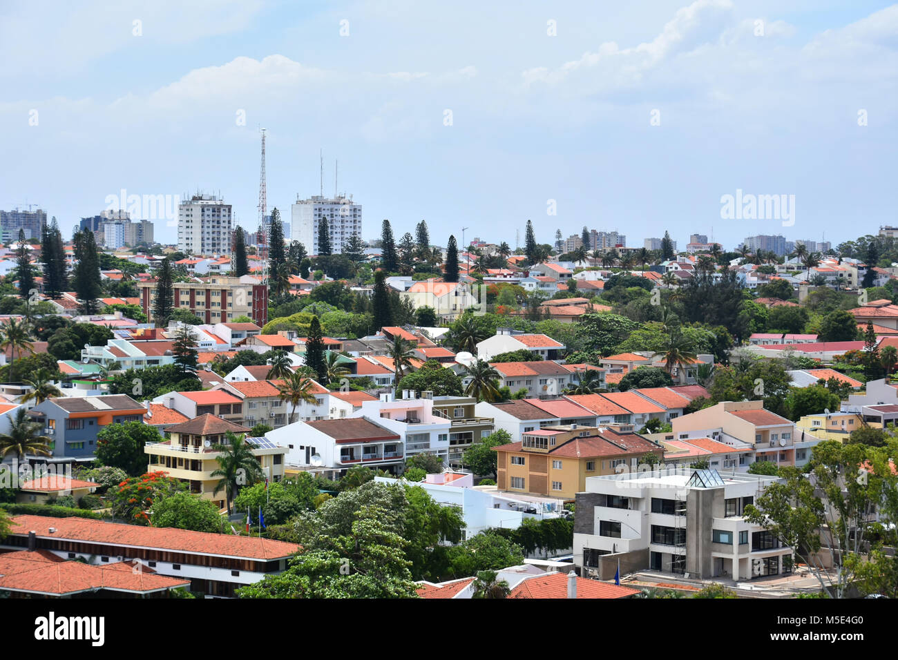 A colorful elevated view of houses in a residential area in Maputo, the ...
