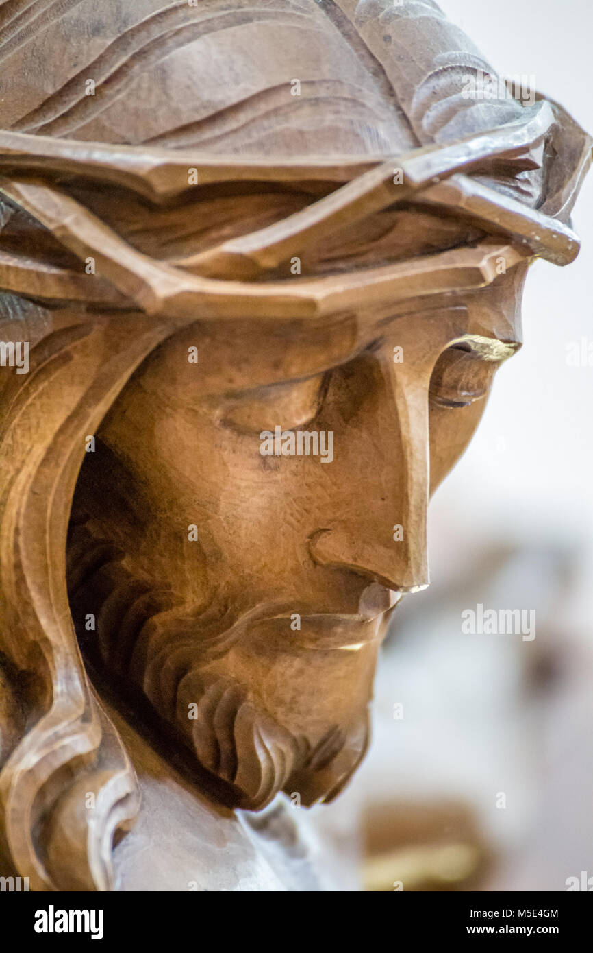 closeup of wooden statue of Jesus Christ with crown of thorns Stock ...