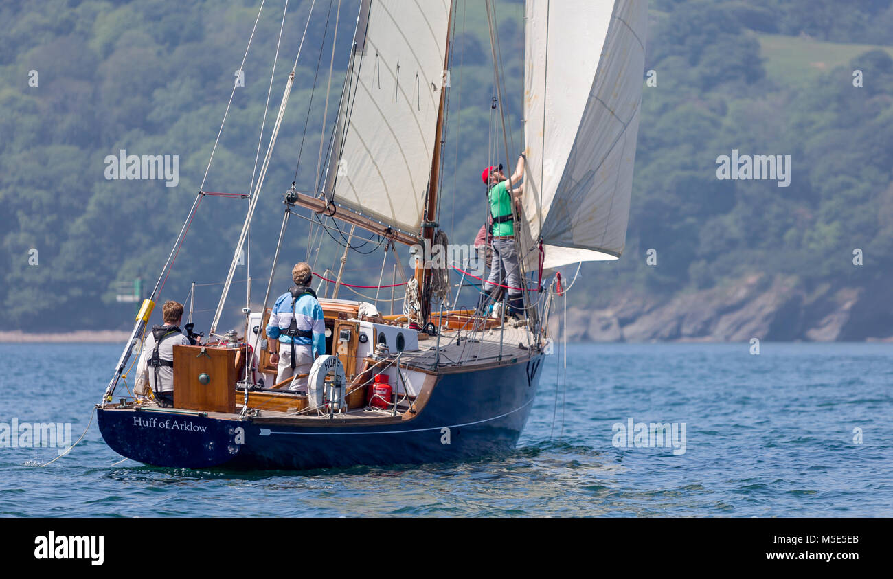 A crew member prepares to change a foresail on the classic Yacht Huff ...