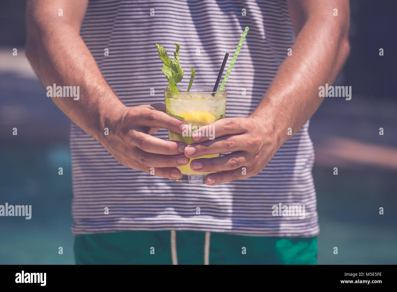 Hands holding cocktail hi-res stock photography and images - Alamy