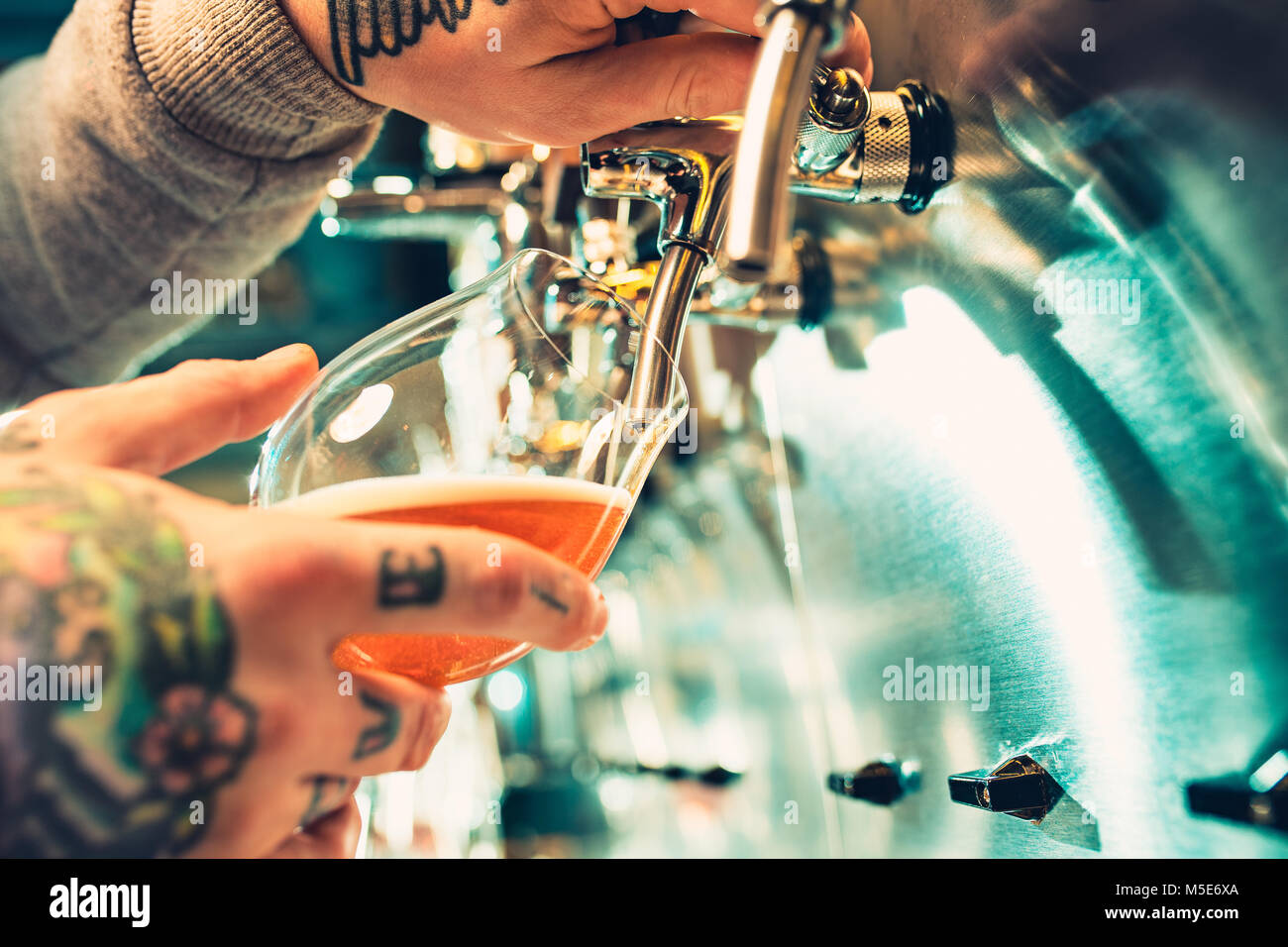 Hand bartender pouring large lager hi-res stock photography and images ...