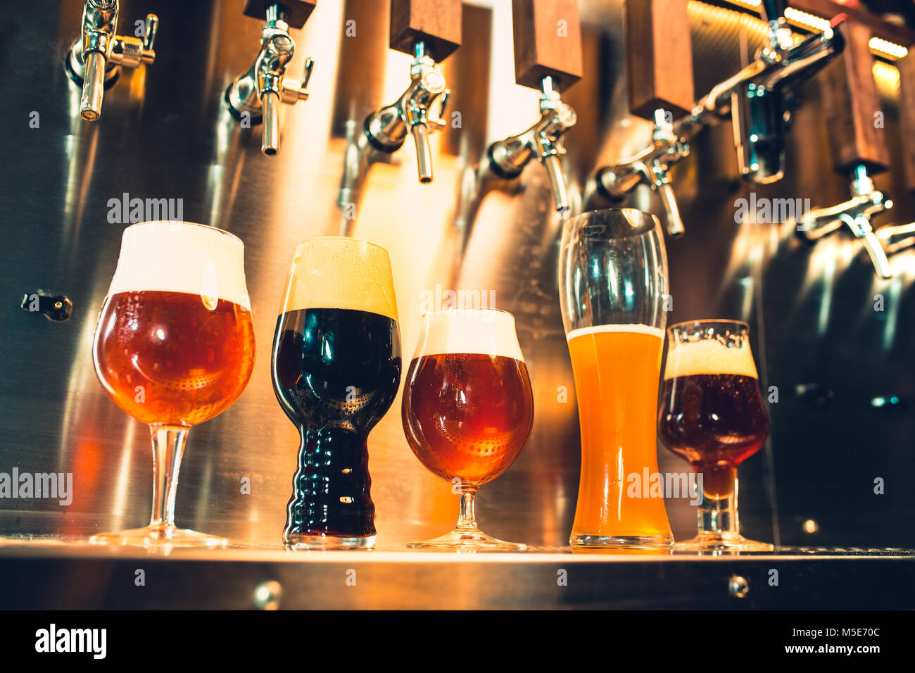 Beer craft. Bar table. Steel taps. Shiny taps. Glassses with beer Stock ...