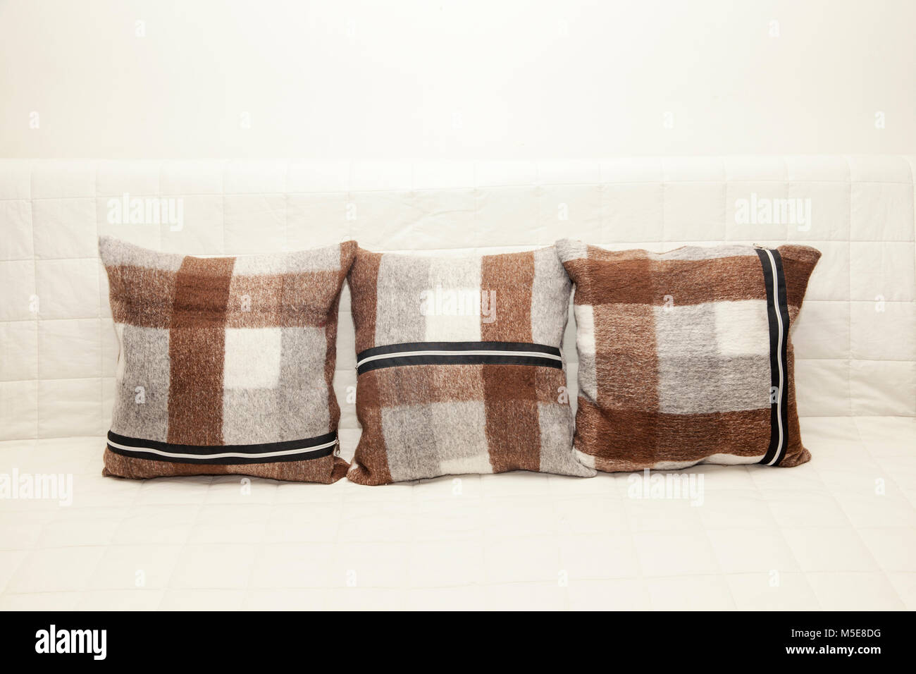 decorative small pillow on the bed, close up Stock Photo - Alamy